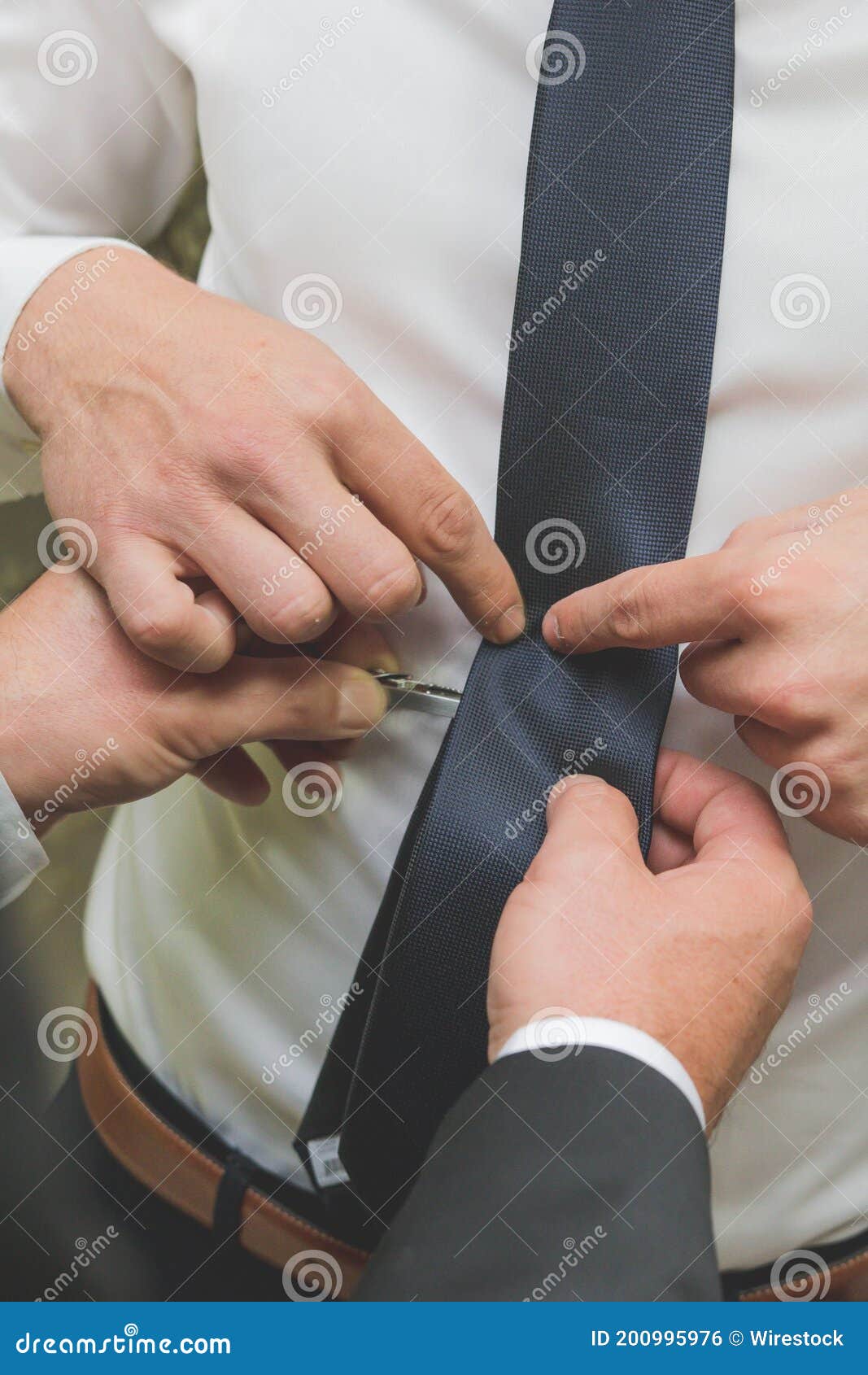 Vertical Shot of a Male Fixing a Tie Stock Photo - Image of elegance ...