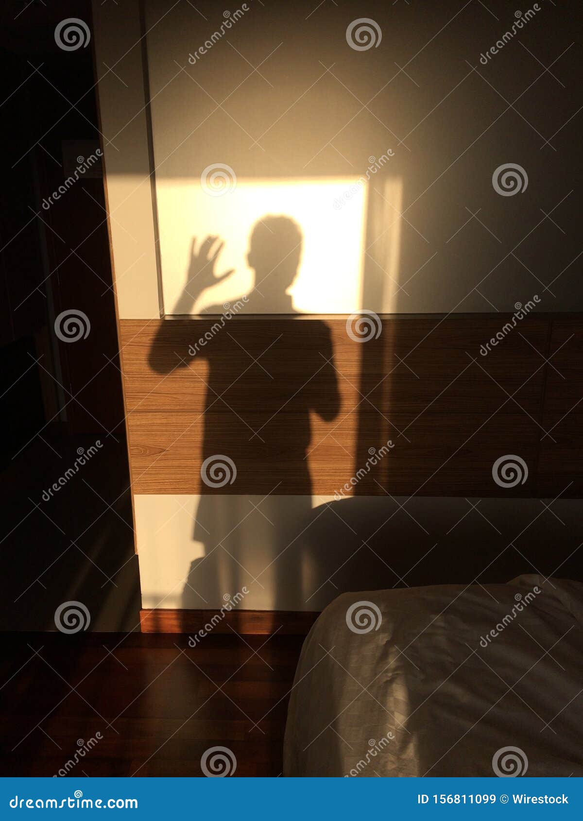 Vertical Shot of a Male Shadow Waving on a Wall Stock Image - Image of ...