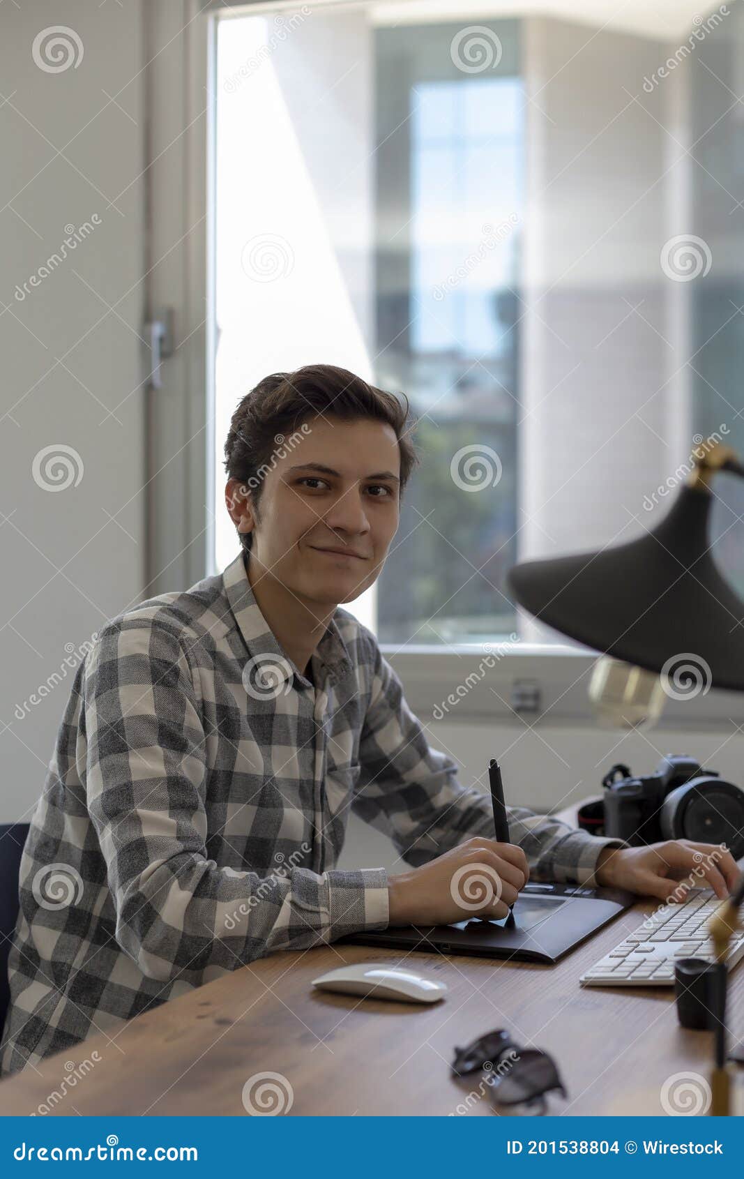 Vertical Shot of a Man Working on a Computer Stock Photo - Image of ...