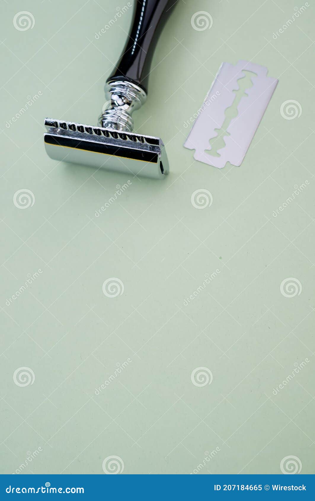 Vertical Shot of a Mechanical Razor and Blade Isolated on Light Green ...