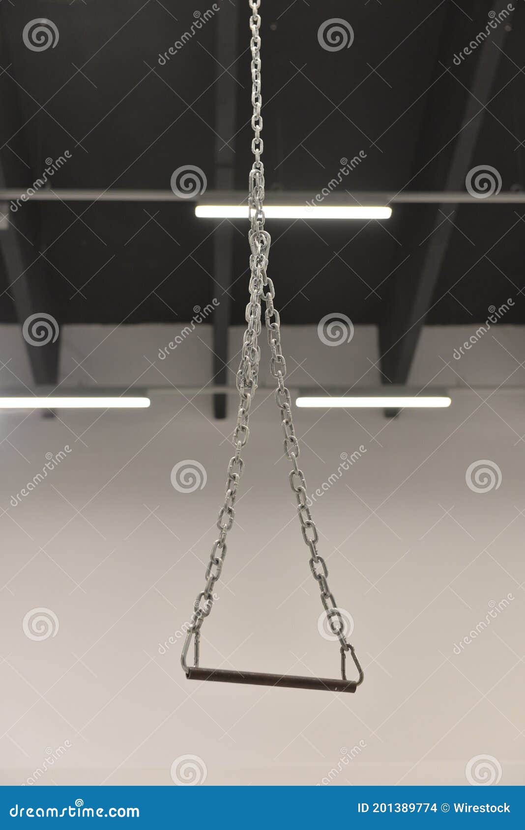 Vertical Shot of a Metal Chain with a Metal Stick Hanging on the Office ...