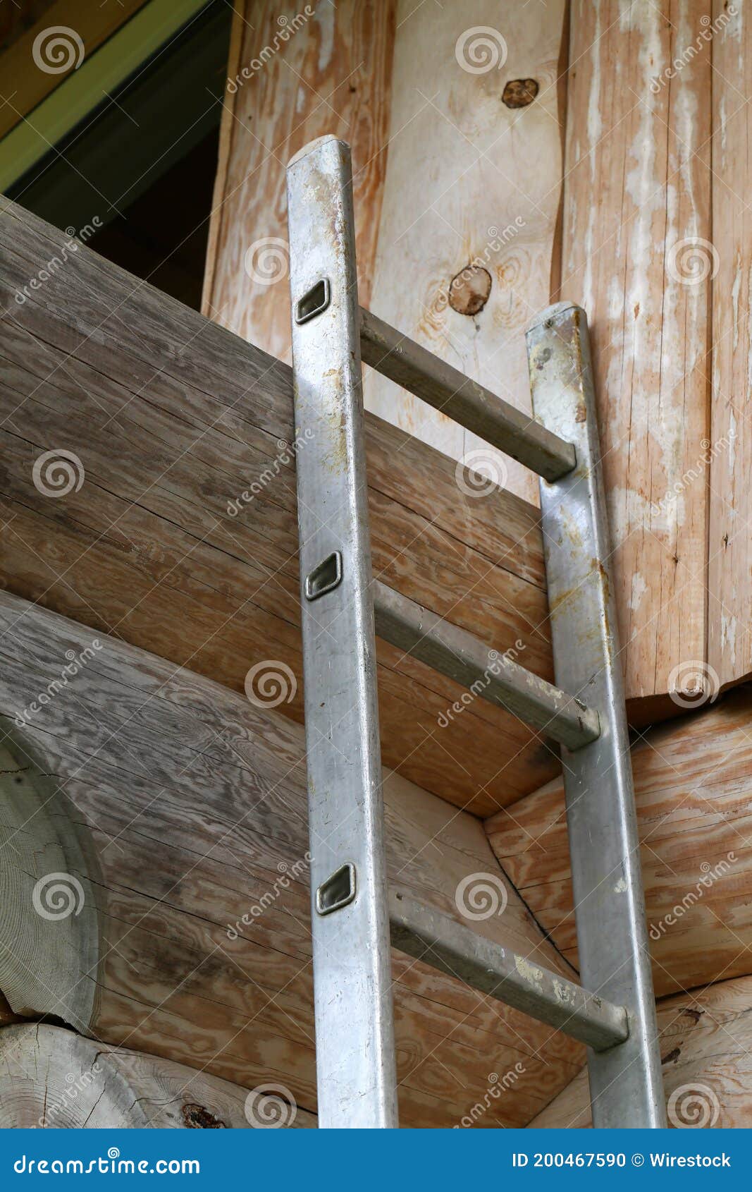 Vertical Shot of a Metal Rusty Ladder Leaned on a Wooden Wall Stock ...