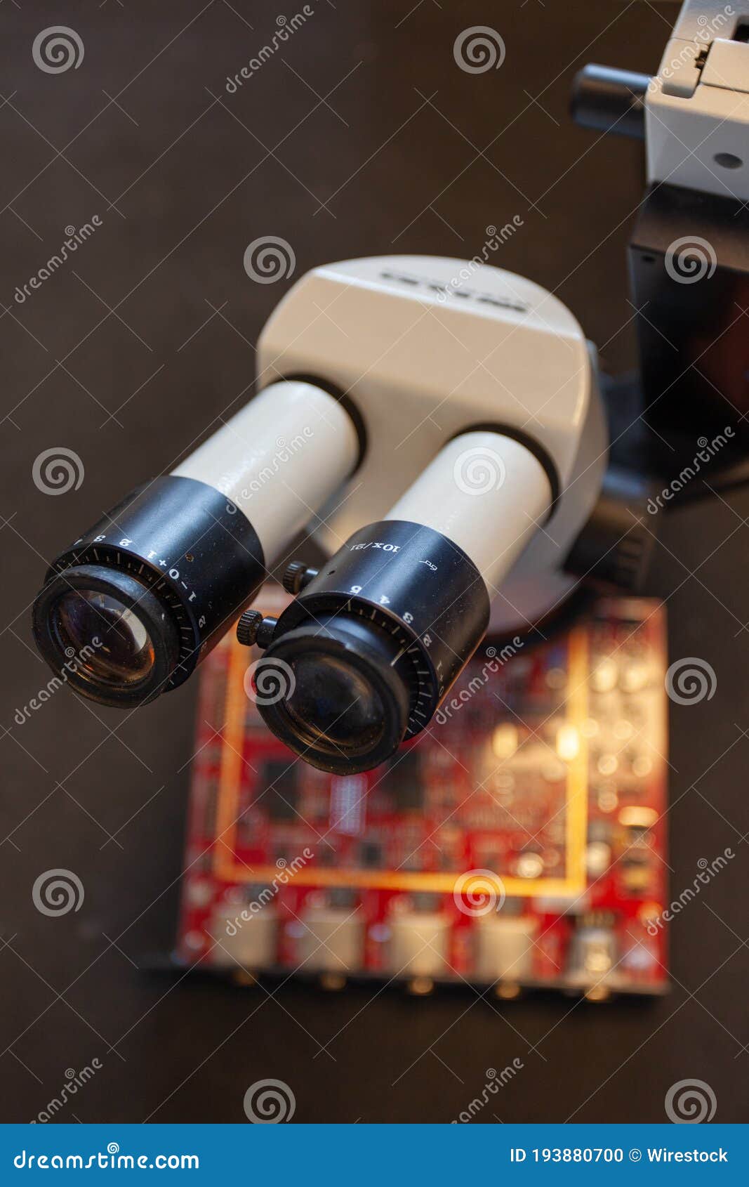 Vertical Shot of Microscope To Repair with a Circuit Board Stock Photo ...