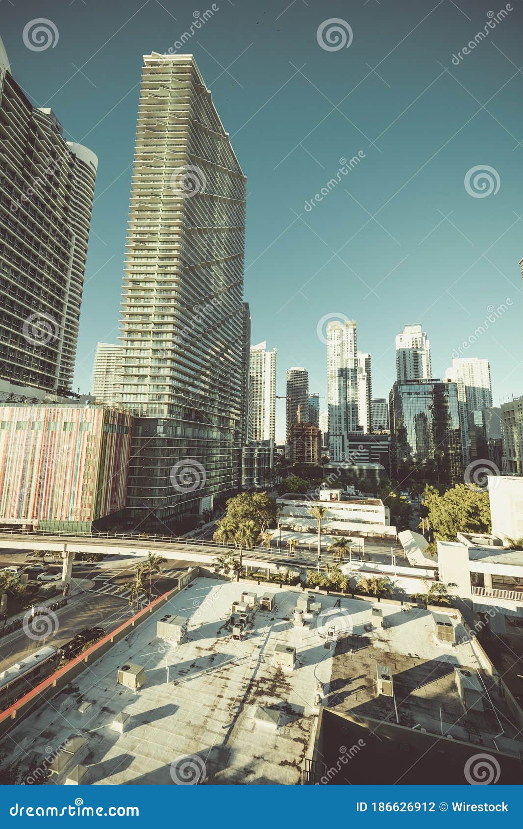 Vertical Shot of Modern High Rise Building in a Clear Blue Sky Stock ...