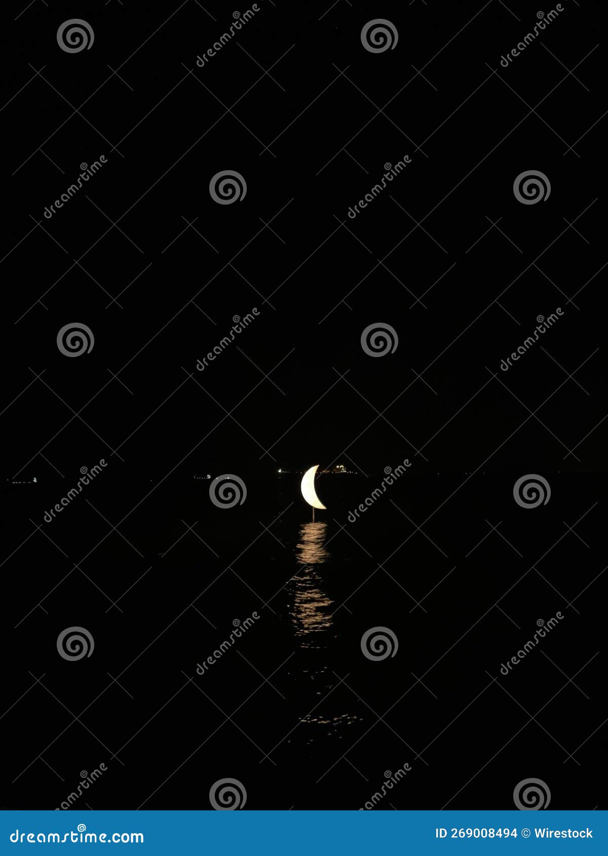 Vertical Shot of a Moon-shaped Light Bulb on the Water Stock Photo ...