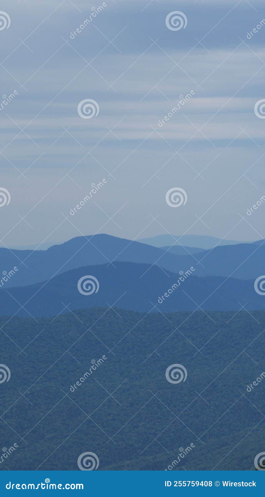 Vertical Shot of Mountain Ranges Under Cloudy Sky Stock Photo - Image ...