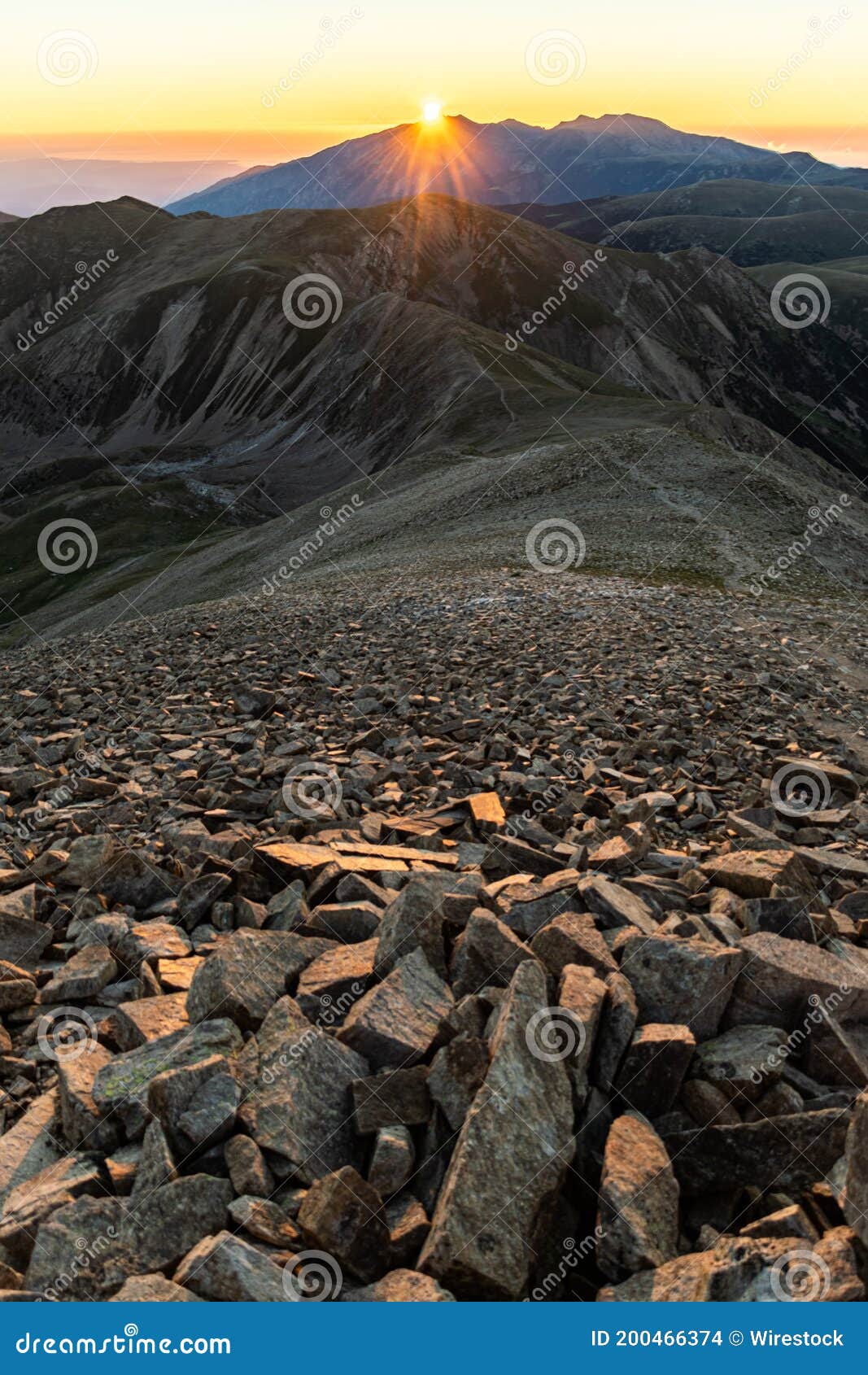 Vertical Shot of Mountainscapes during an Evening Stock Photo - Image ...