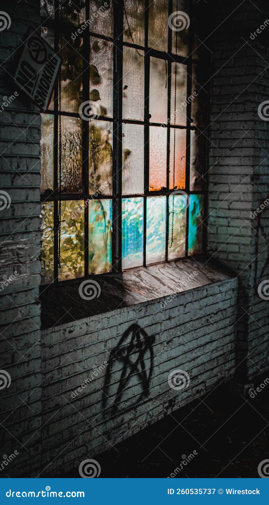 Vertical Shot of an Multicolor Window in an Abandoned Building with a ...