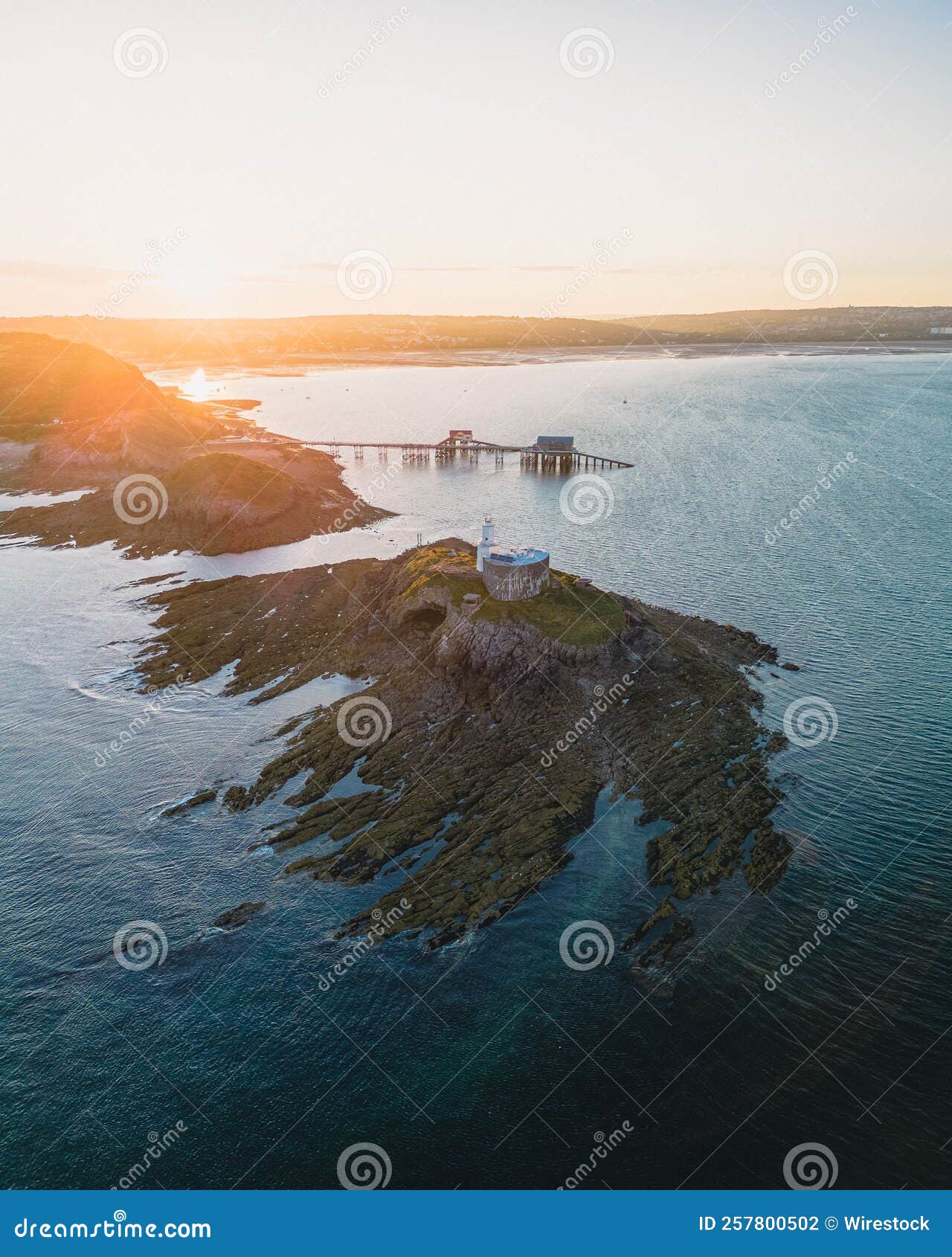 Vertical Shot of the Mumbles Lighthouse at Sunset Stock Photo - Image ...