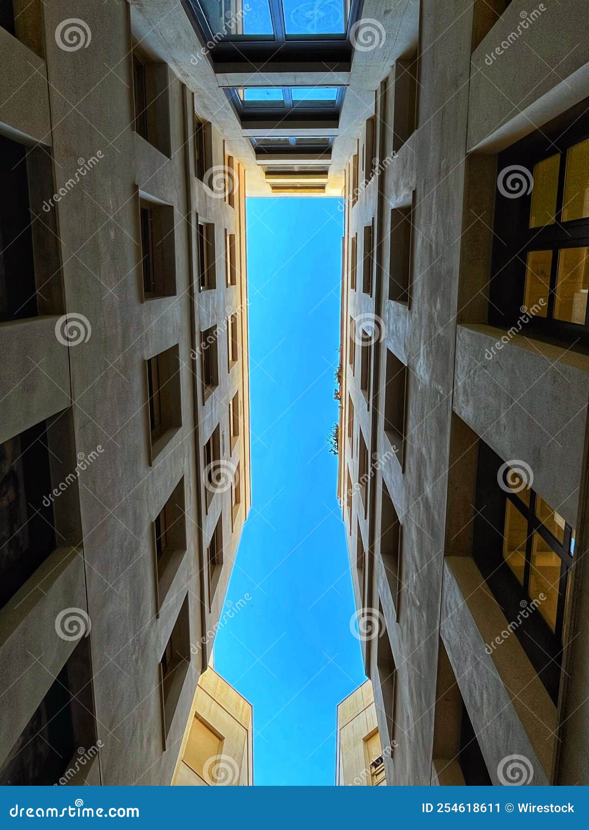 Vertical Shot of a Narrow Gap between Buildings Stock Image - Image of ...