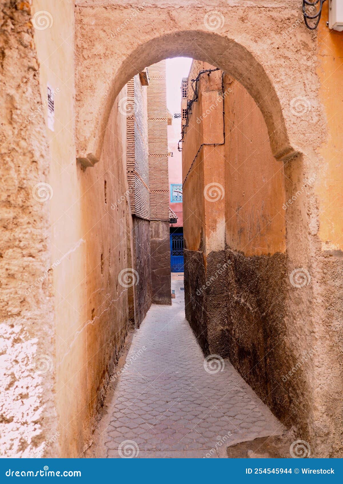 Vertical Shot of a Narrow Path through an Ancient Arch in Marrakesh ...