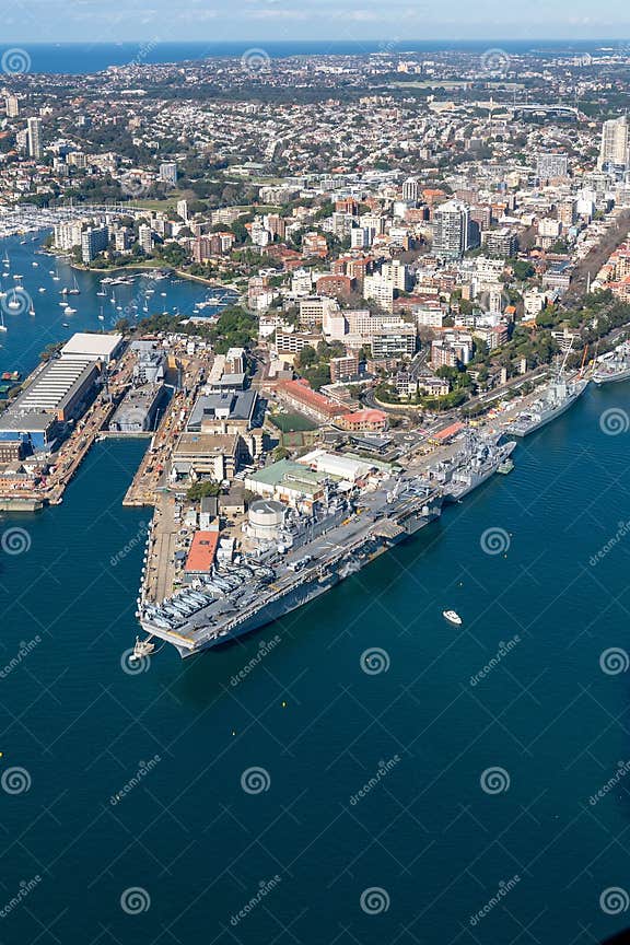 Vertical Shot of a Naval Base Ship and a City in a Background Editorial ...