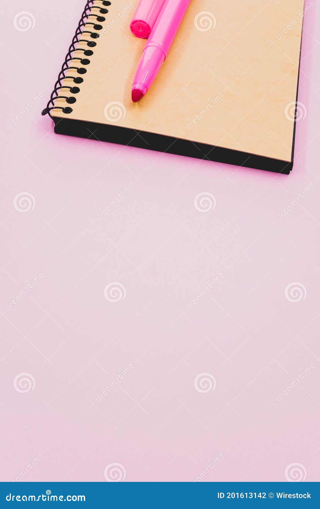 Vertical Shot of a Notebook and a Pink Marker on a Pink Surface Stock ...