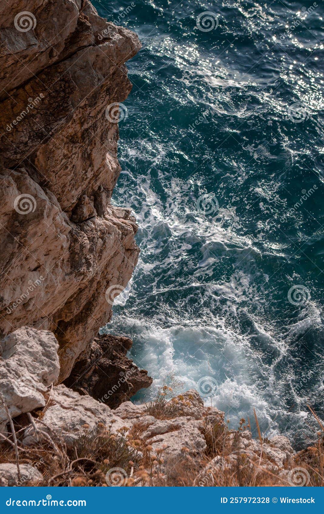 Vertical Shot of Ocean Waves Hitting the Coastal Rocks Stock Photo ...