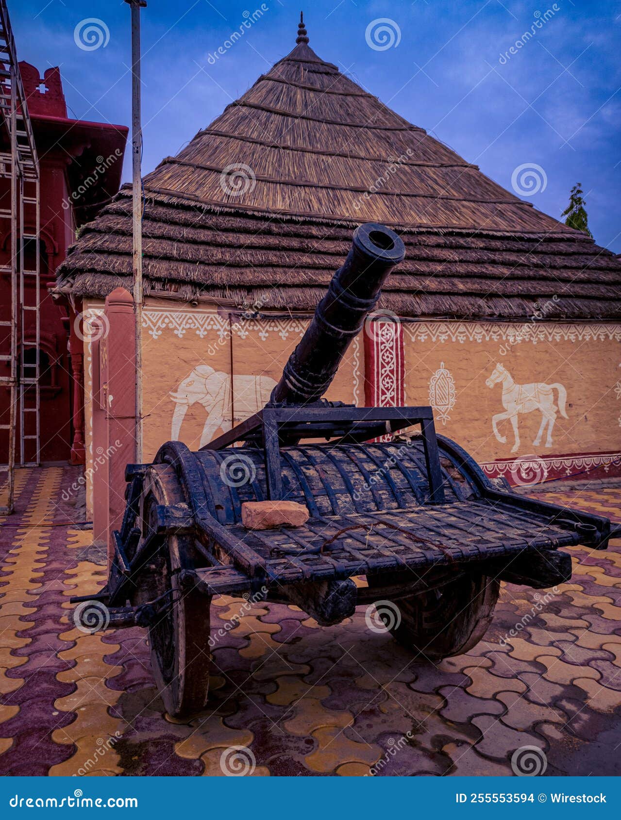 Vertical Shot of an Old Cannon Placed in Front of an Ancient Building ...