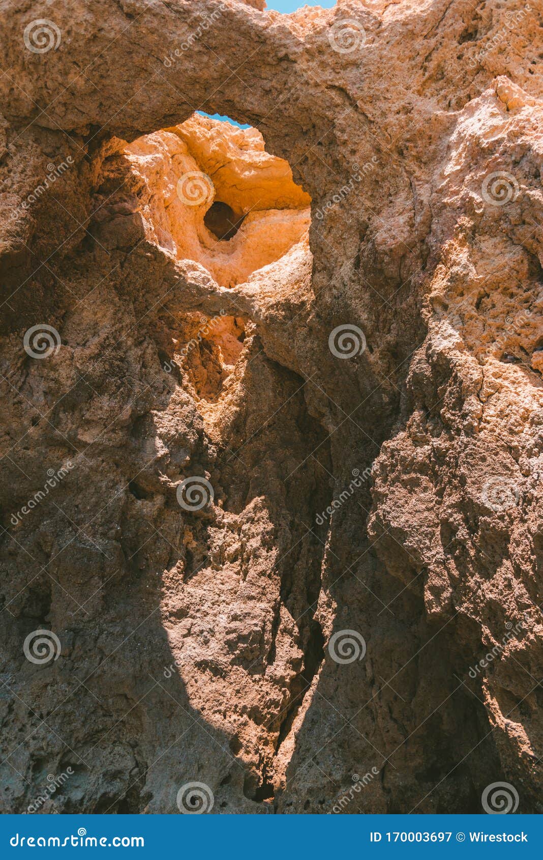 Vertical Shot of an Old Rock Formation with Holes Stock Image - Image ...