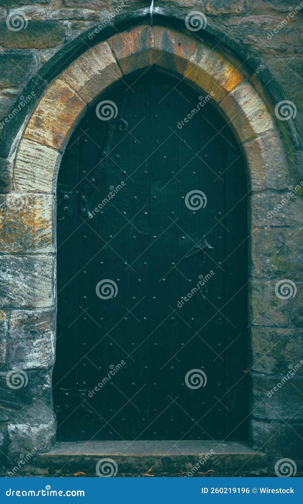 Vertical Shot of an Old Steel Door in the Brick Wall Stock Photo ...
