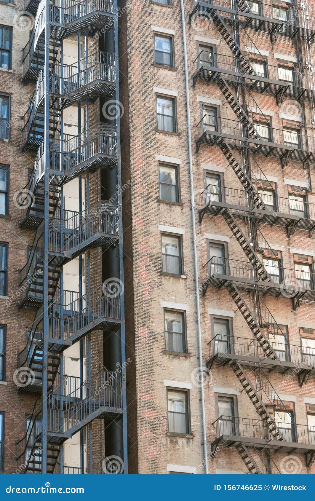 Vertical Shot of Old Stone Apartment Buildings with Fire Exit ...