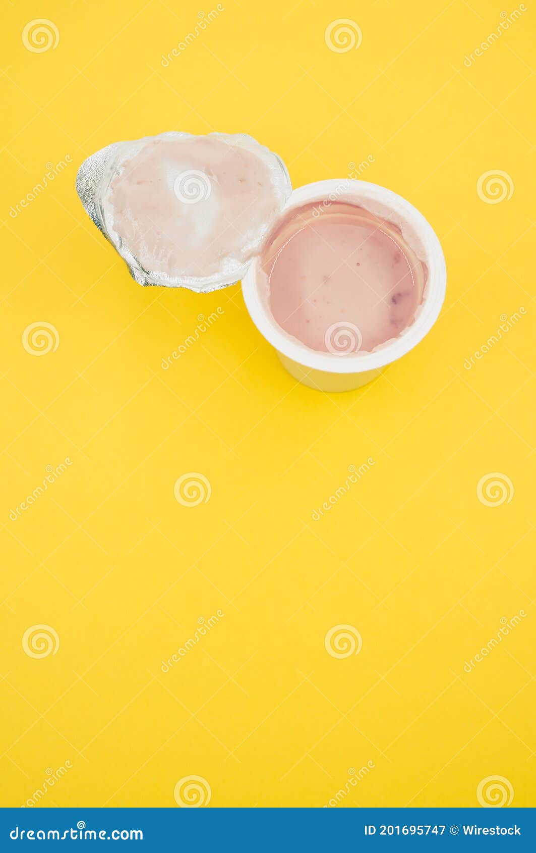 Vertical Shot of an Opened Plastic Container of Fruit Yogurt on a ...