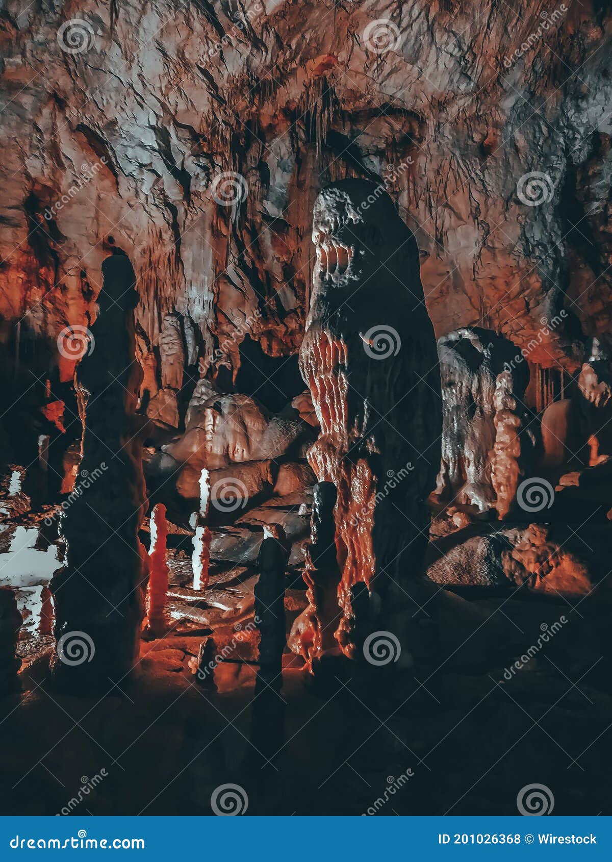 Vertical Shot of Orange Cave Walls and Stone Formations Stock Photo ...