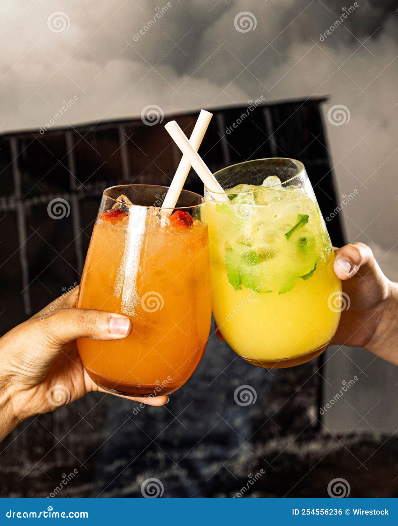 Vertical Shot of Orange and Yellow Mocktail Drinks with Straws Stock ...