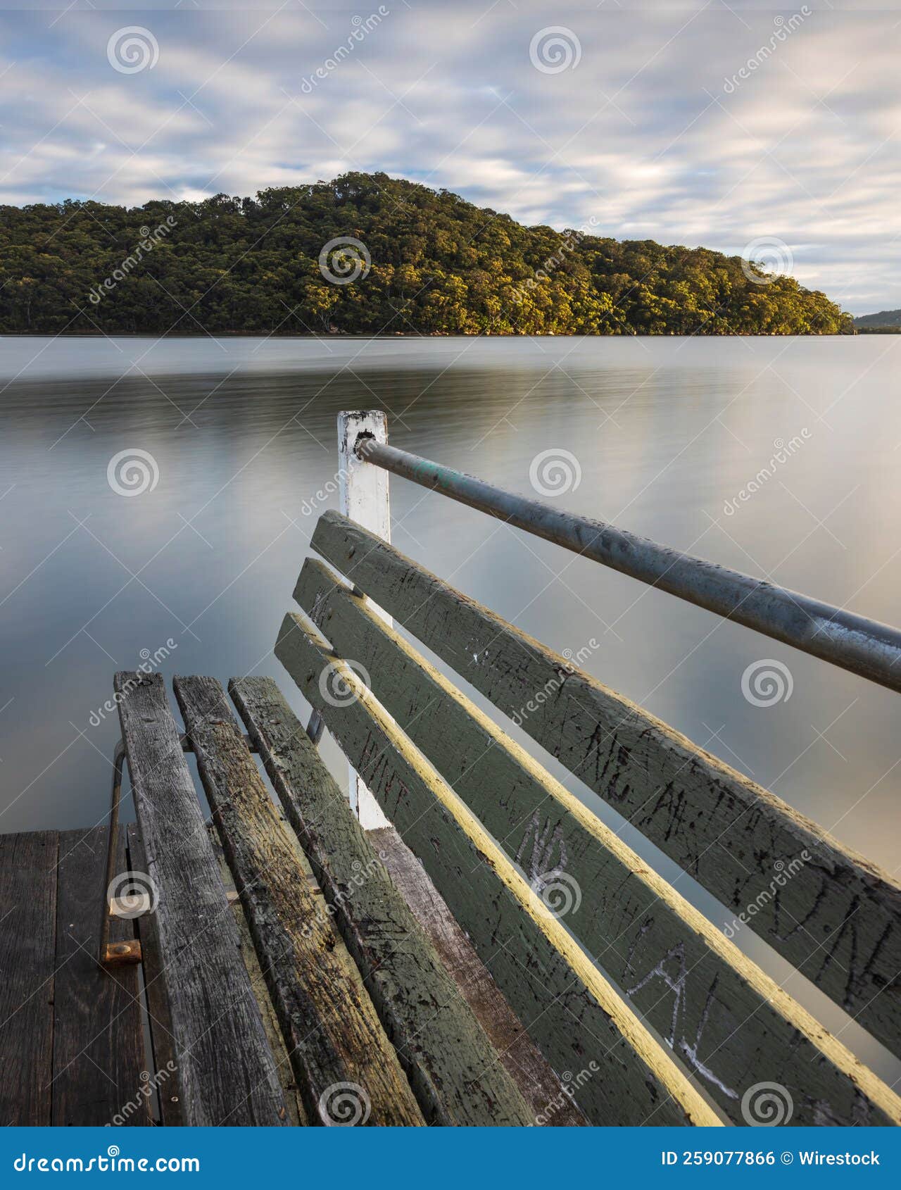 Vertical Shot of a Park Bench Near the Lake Stock Photo - Image of pier ...