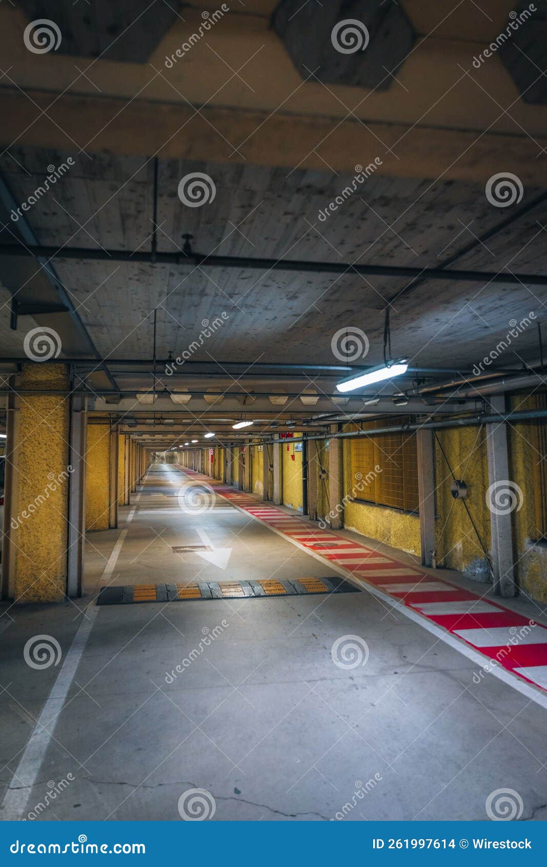 Vertical Shot of a Parking Deck with Arrows, Speed Bump, and Signs ...
