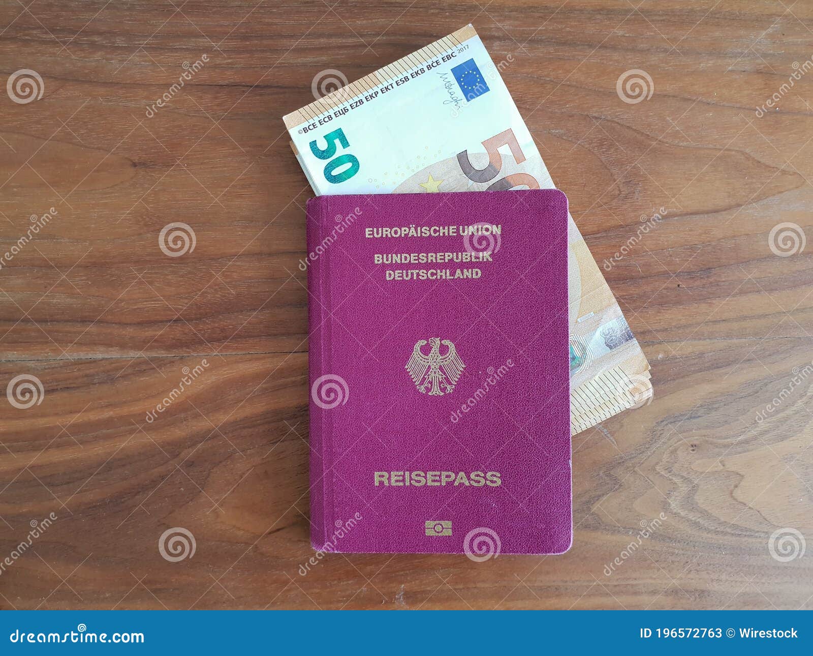 Vertical Shot of a Passport with Paper Bills Inserted To it Stock Image ...