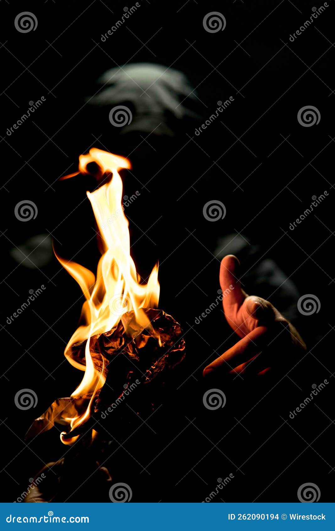 Vertical Shot of a Person Holding a Fire Torch in the Dark Stock Photo ...