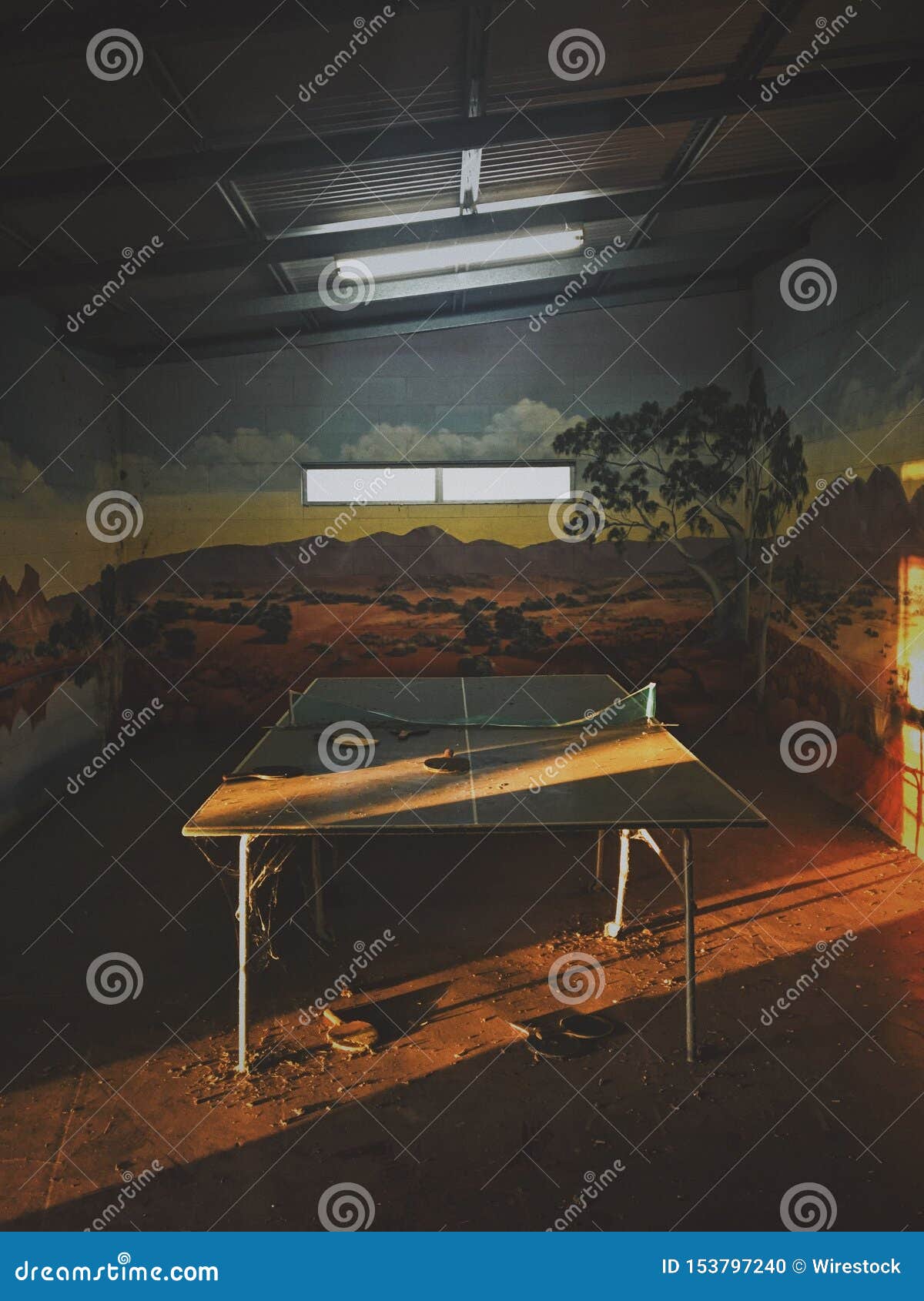 Vertical Shot of Ping Pong Table in a Room Withdrawing on a Wall and ...