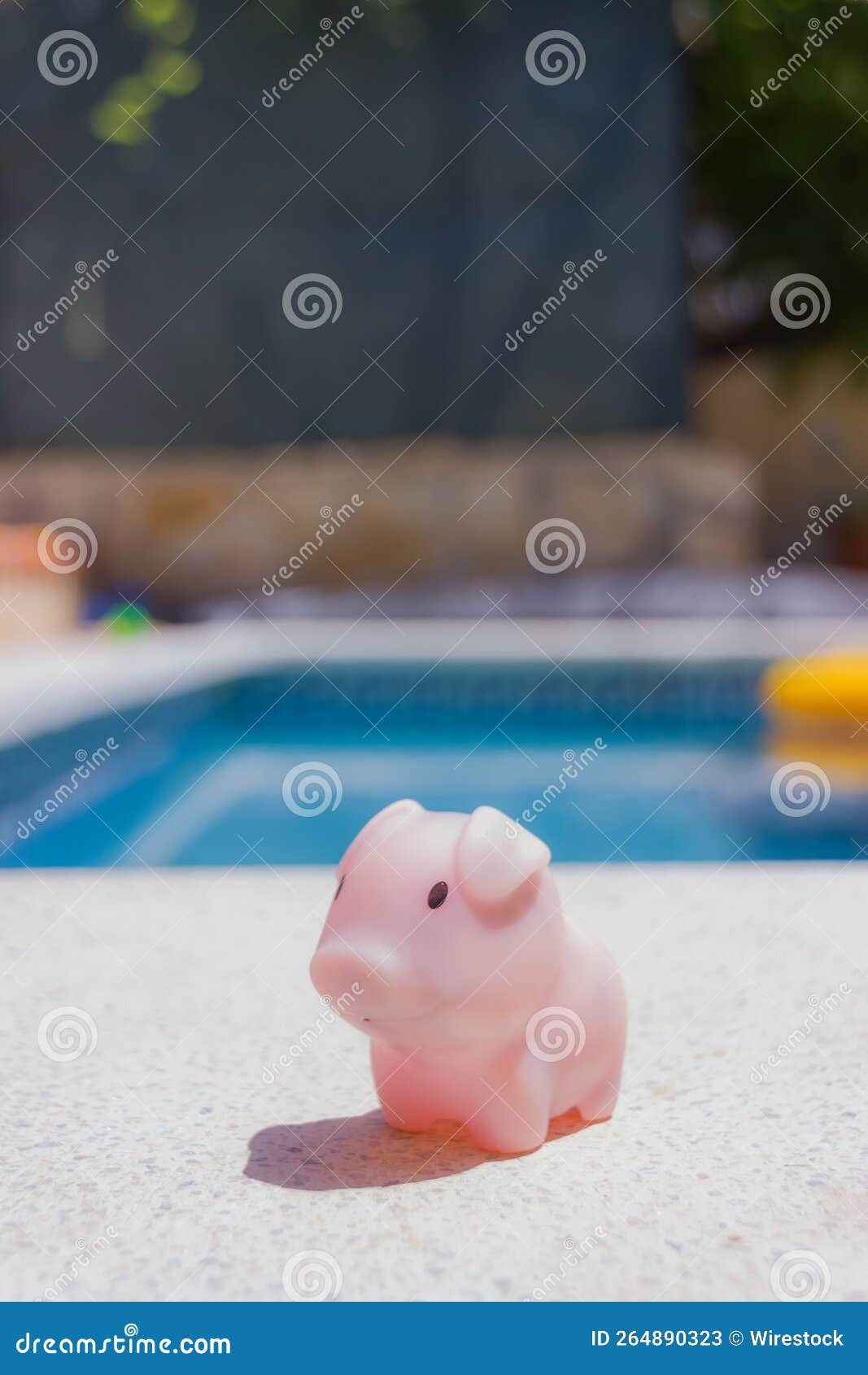 Vertical Shot of a Pink Piglet Toy on a Ledge Over a Pool Stock Image ...