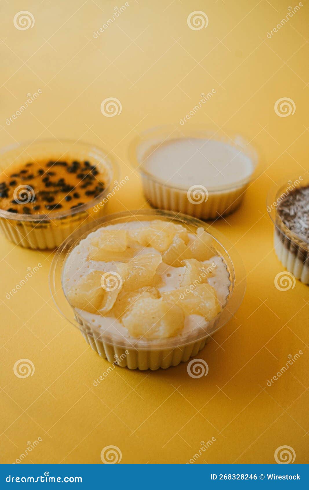 Vertical Shot of Plastic Containers with Creamy Pudding with Various ...