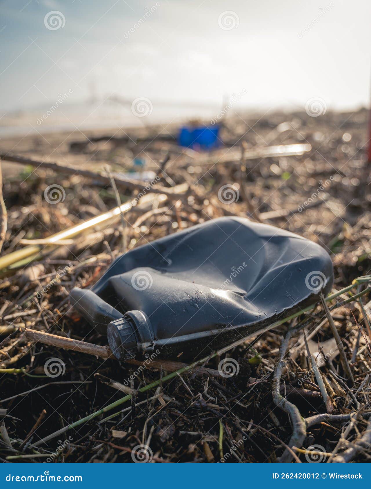 Vertical Shot of Plastic Containers on the Ground Outdoors Stock Photo ...