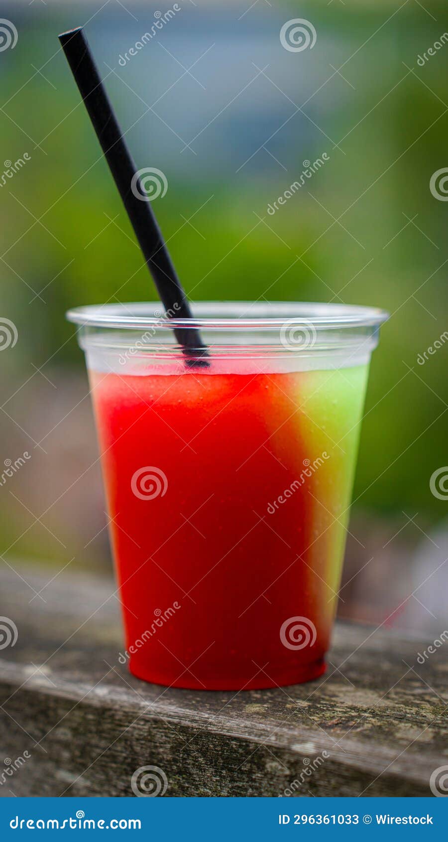 Vertical Shot of a Plastic Cup with a Yellow Red Iced Drink on a ...