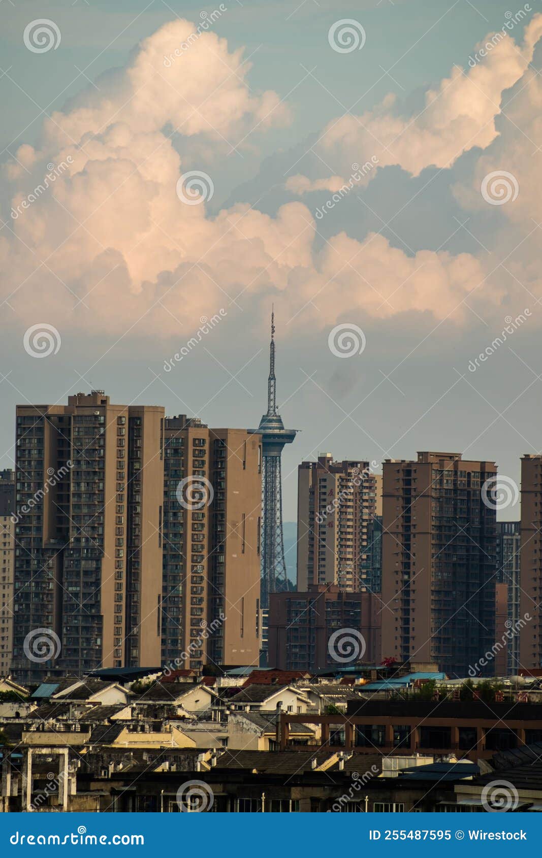 Vertical Shot of a Power Tower and Multi-story Buildings Stock Image ...