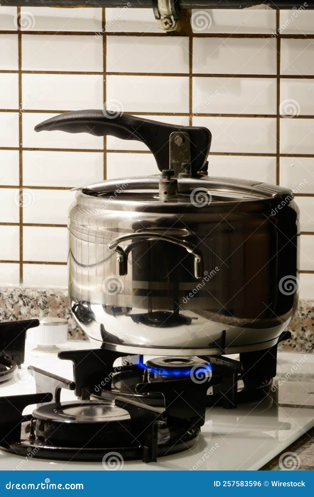 Vertical Shot of a Pressure Pan on Placed on Top of the Stove Stock ...