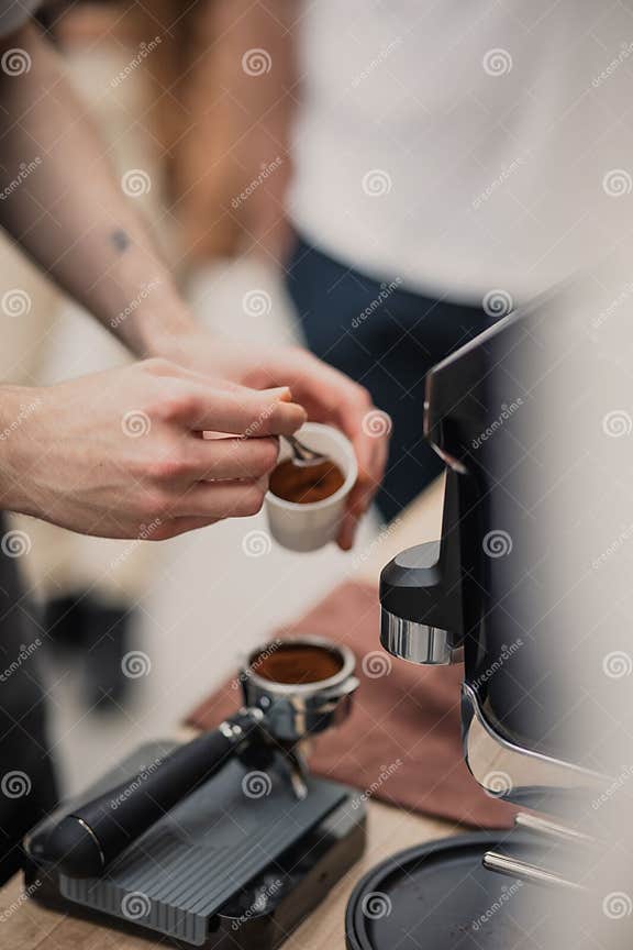 Vertical Shot of a Process of Making an Expresso Coffee with Hands and ...
