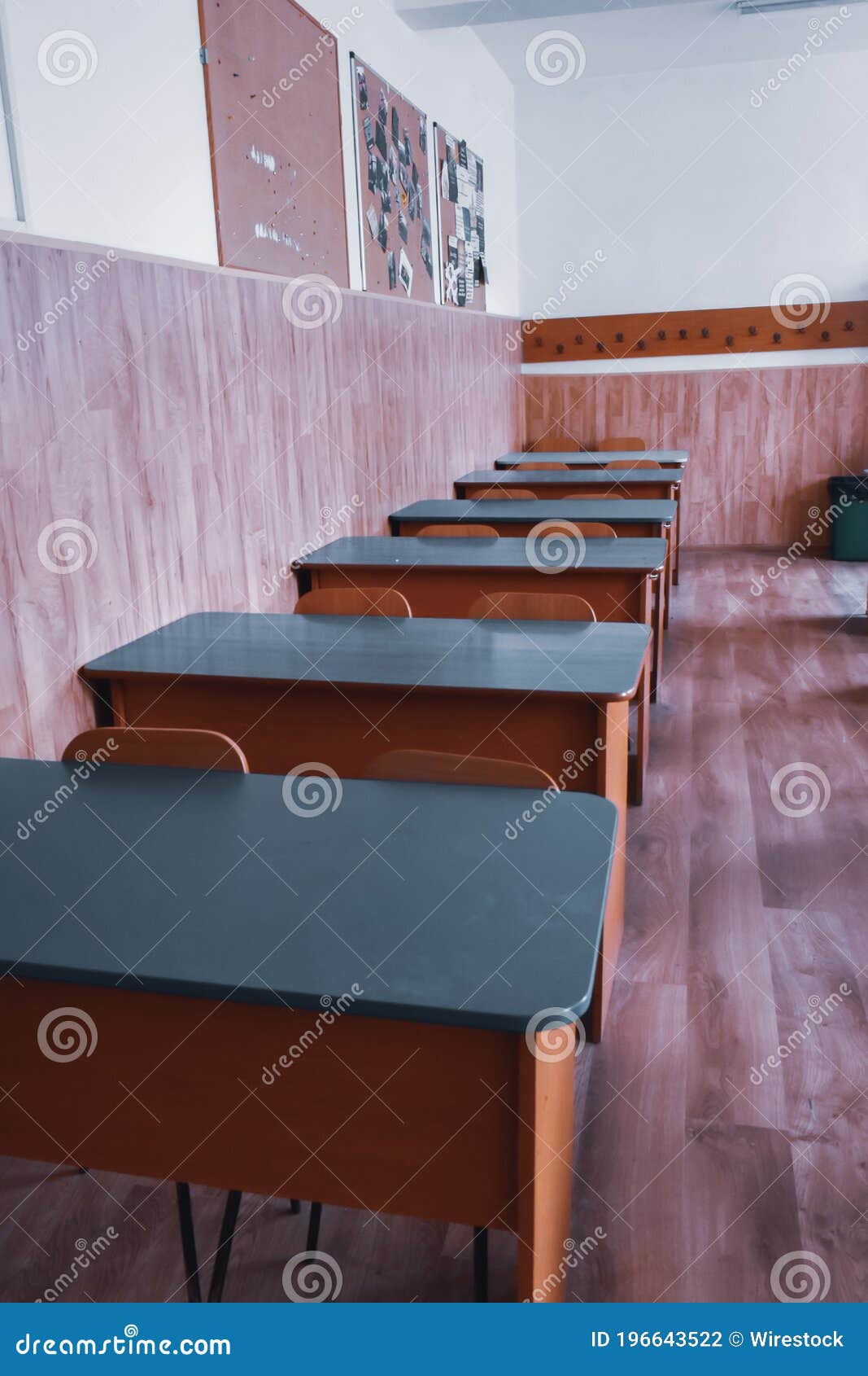 Vertical Shot of a Raw of Tables and Chairs in a Classroom Stock Photo ...