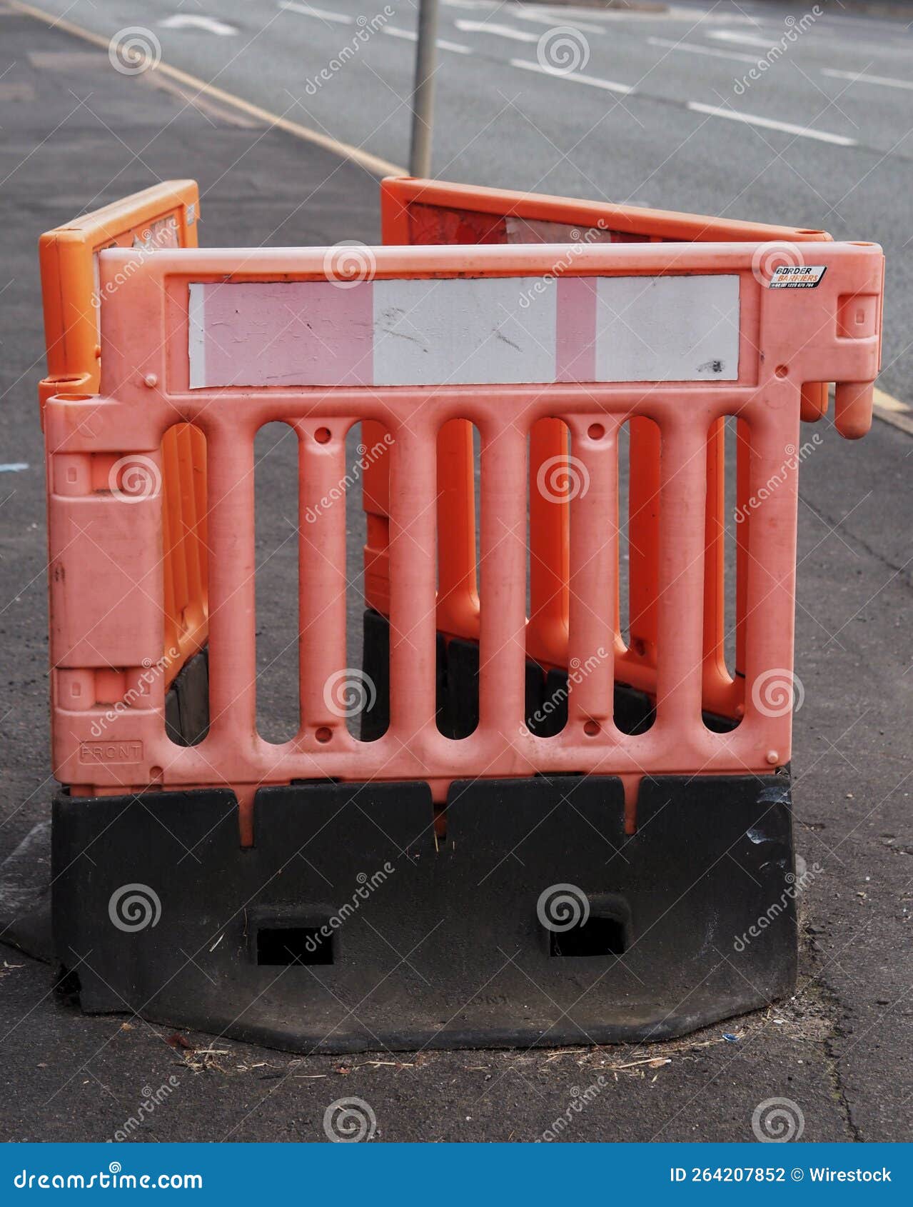 Vertical Shot of a Red Barricade on the Street Stock Photo - Image of ...