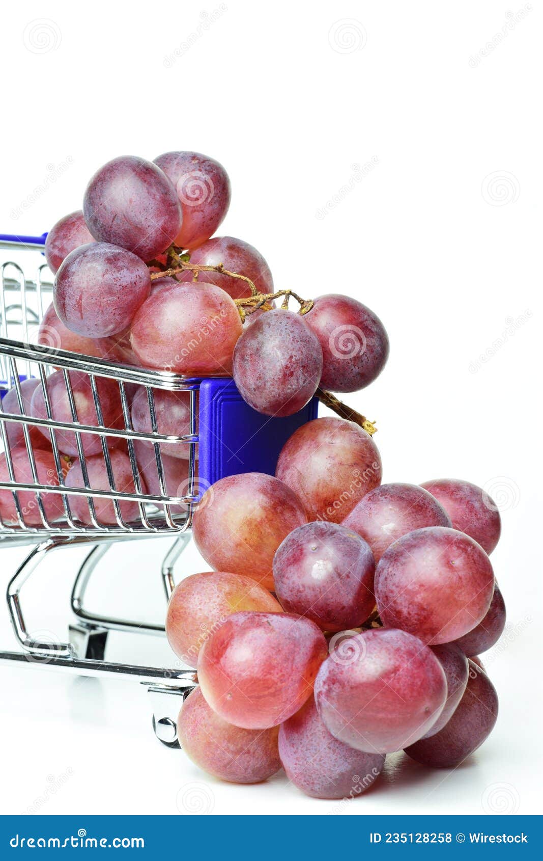 Vertical Shot of Red Grape Clusters in a Shopping Cart in the White ...