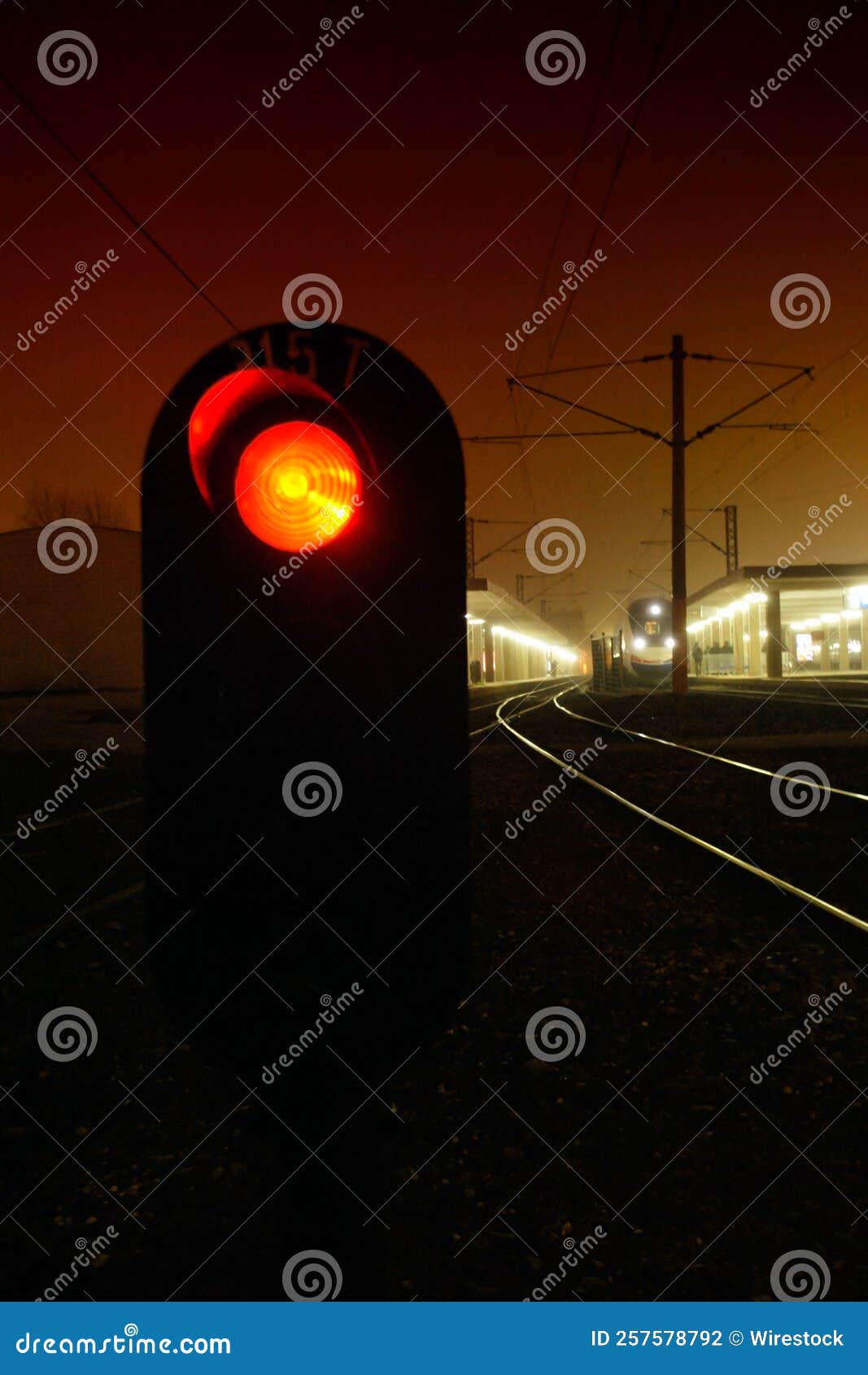 Vertical Shot of the Red Light on the Railroad at Night Stock Photo ...