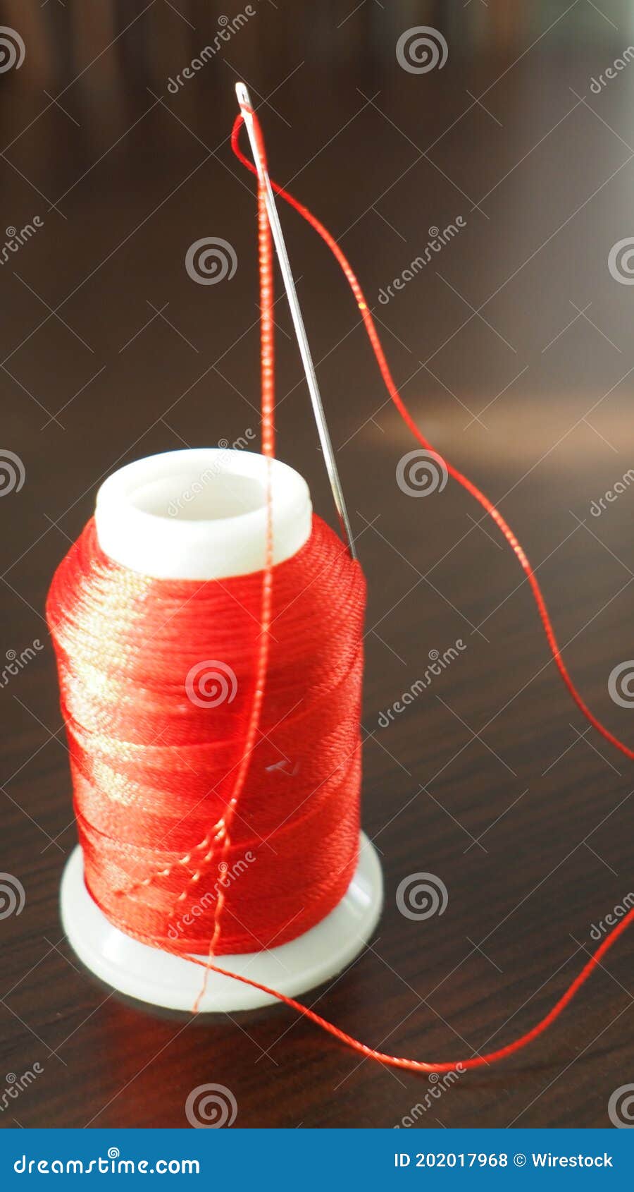 Vertical Shot of Red Thread and a Needle Stock Photo - Image of thread ...
