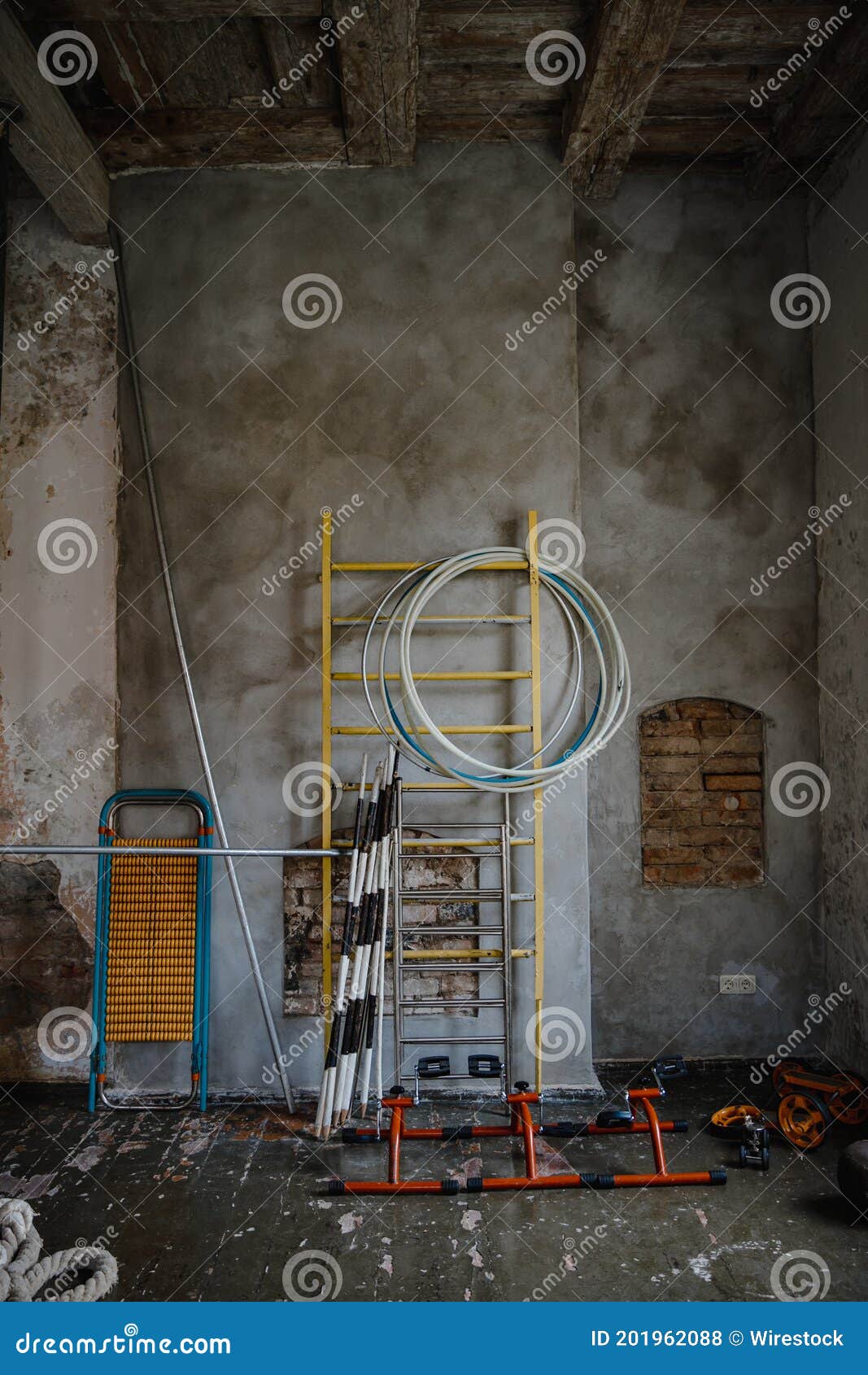 Vertical Shot of Renovation Tools and Ladders in a Construction Site ...