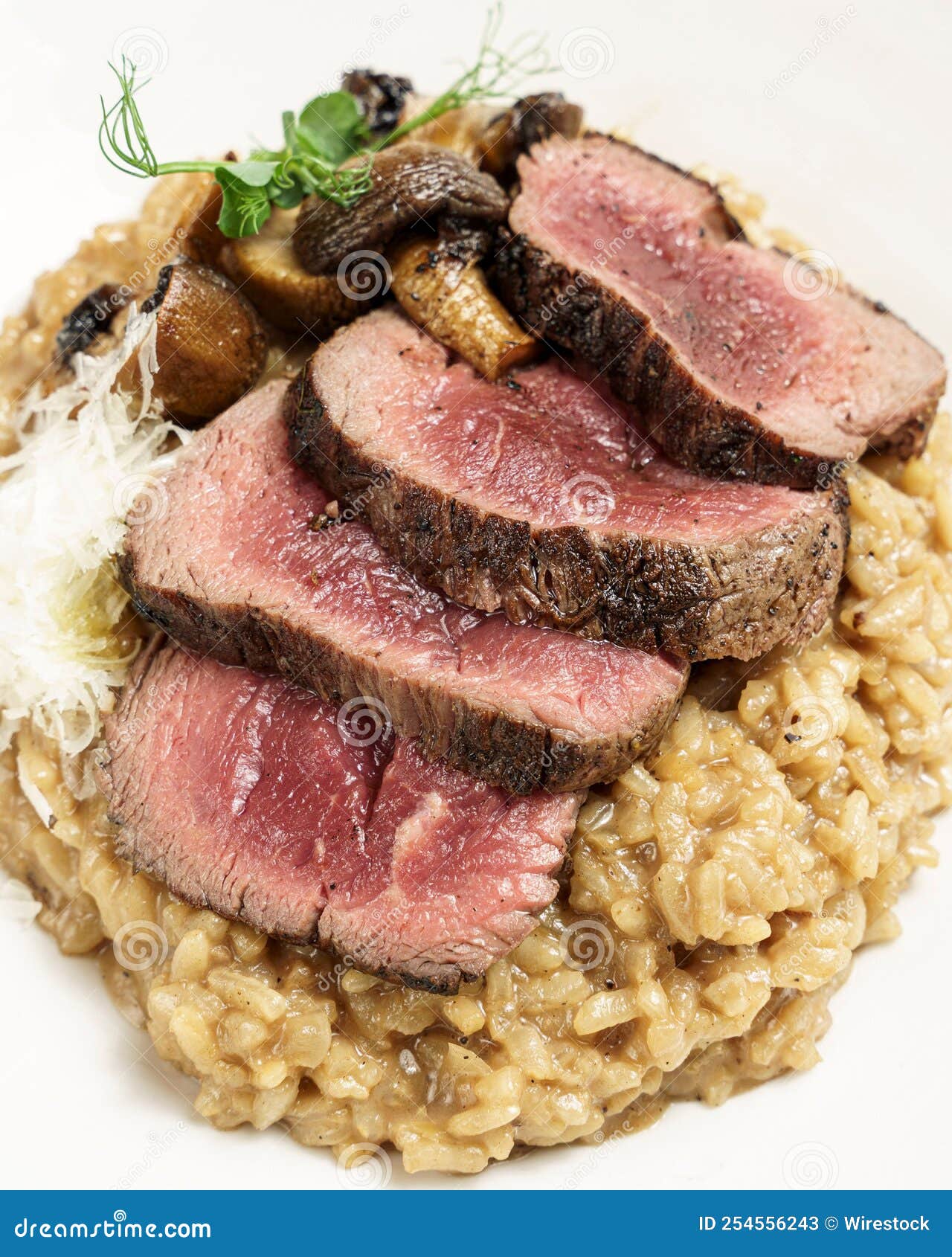 Vertical Shot of a Risotto with a Medium Rare Steak Stock Image - Image ...