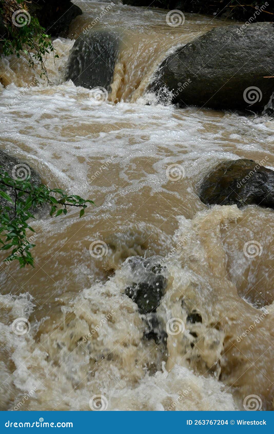 Vertical Shot of a River Flowing Over Rocks Stock Photo - Image of ...