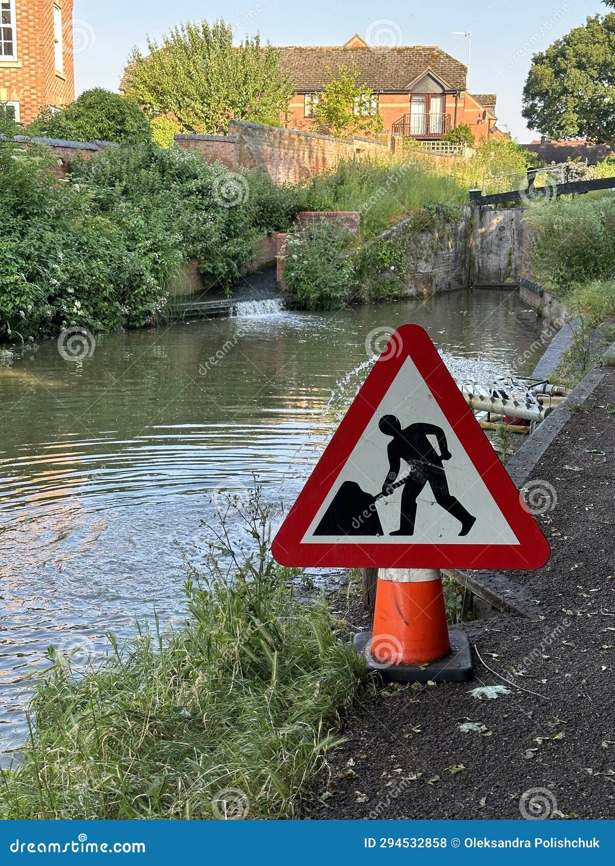 Roadworks Sign on the River Bank Stock Photo - Image of vertical ...