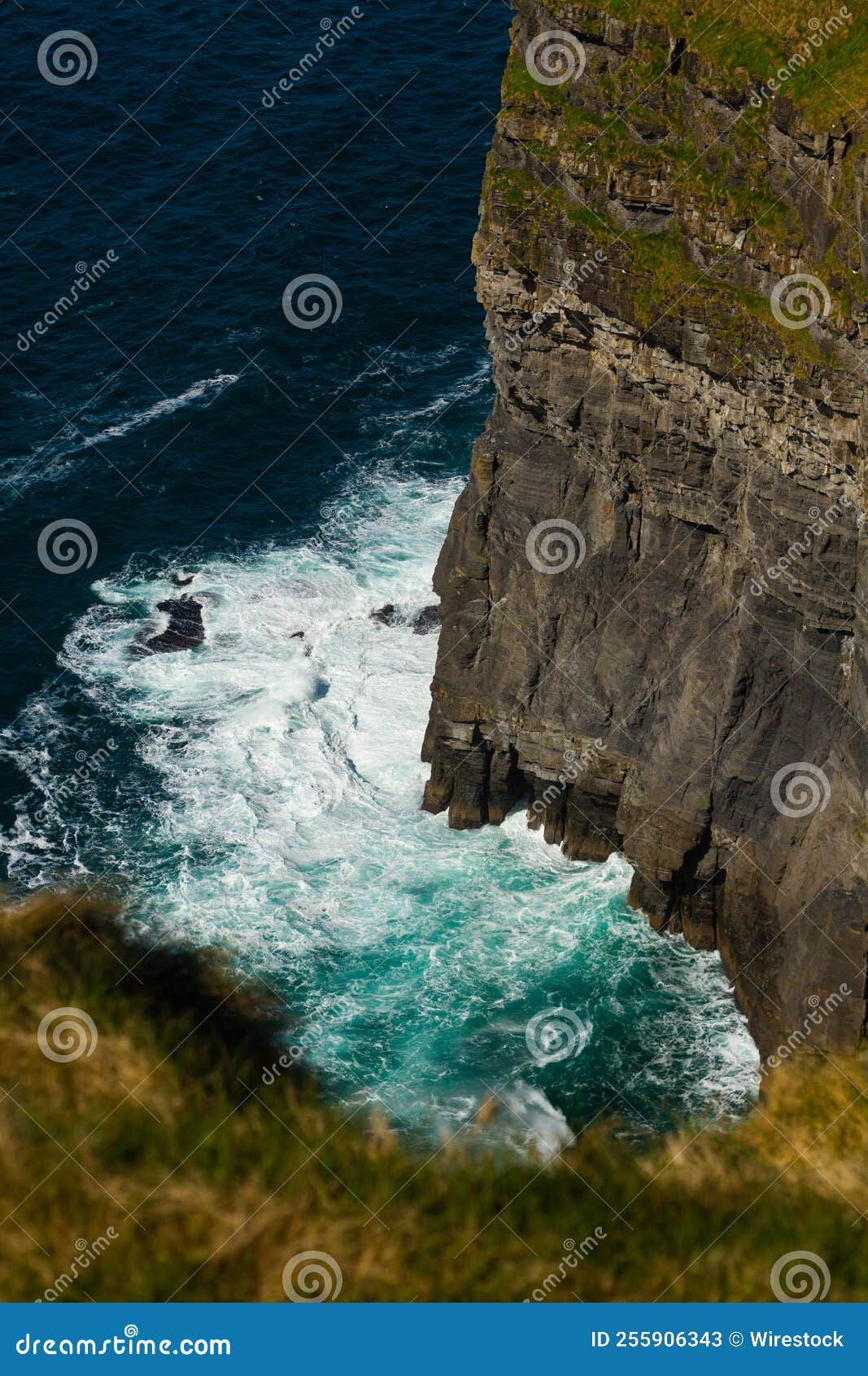 Vertical Shot of the Rocky Cliff and the Sea Stock Image - Image of ...