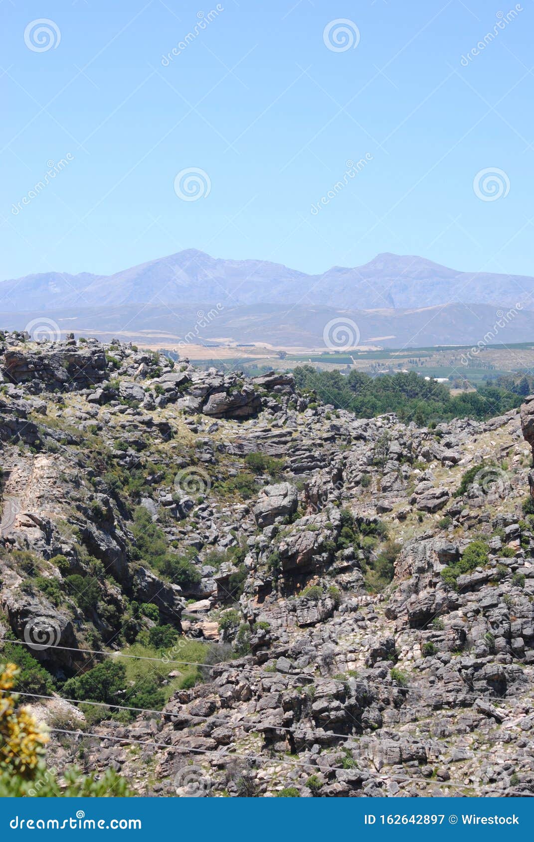 Vertical Shot of Rocky Outcrops in the Mountains and the Sky in the ...