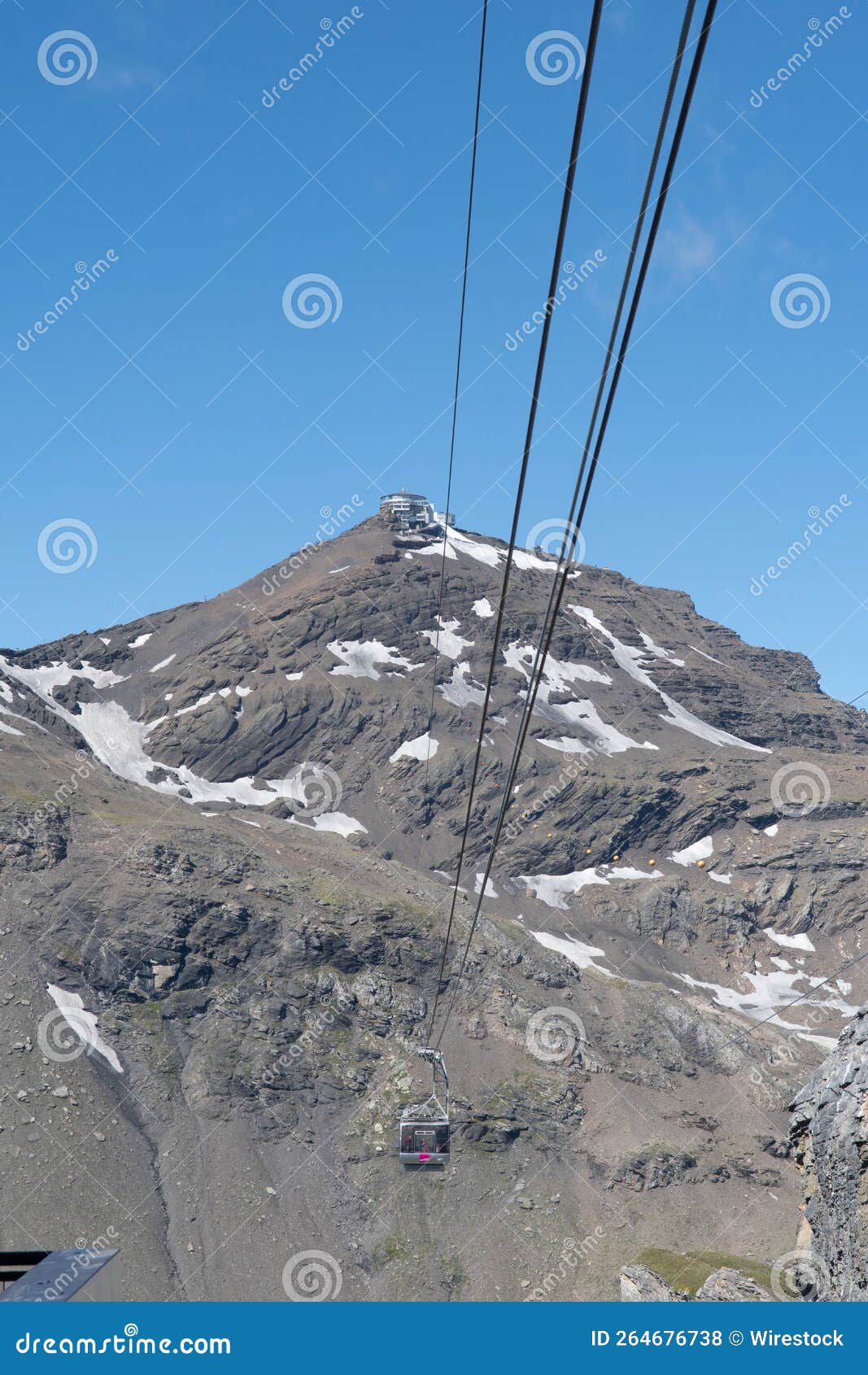 Vertical Shot of the Ropeway Hanging from the Wires with Mountains in ...
