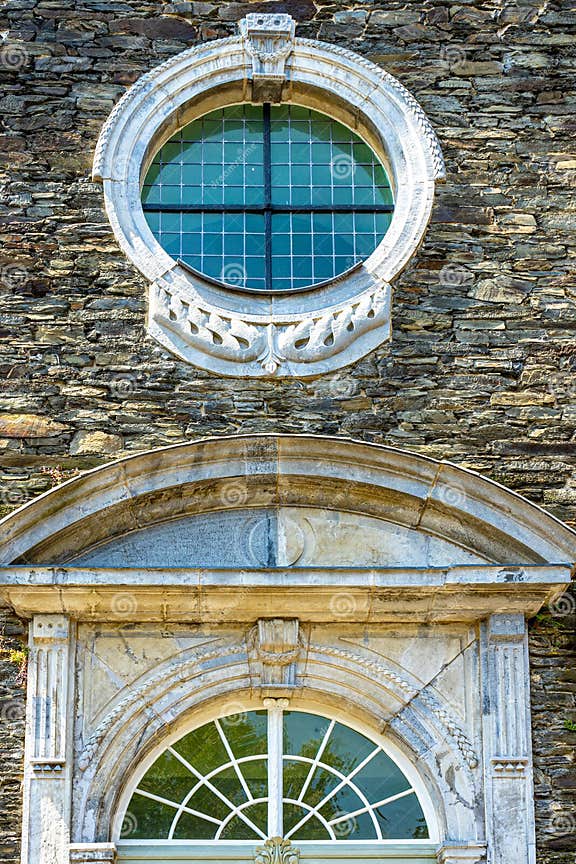 Vertical Shot of a Round Window on a Stone Wall Building Stock Photo ...